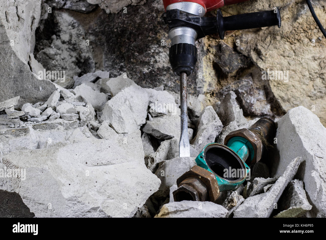 Demolition of walls. Electric hammer helmet and hearing protection ...
