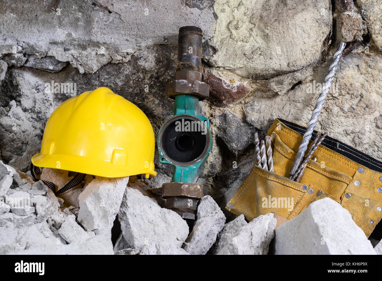 Demolition of walls. Electric hammer helmet and hearing protection ...