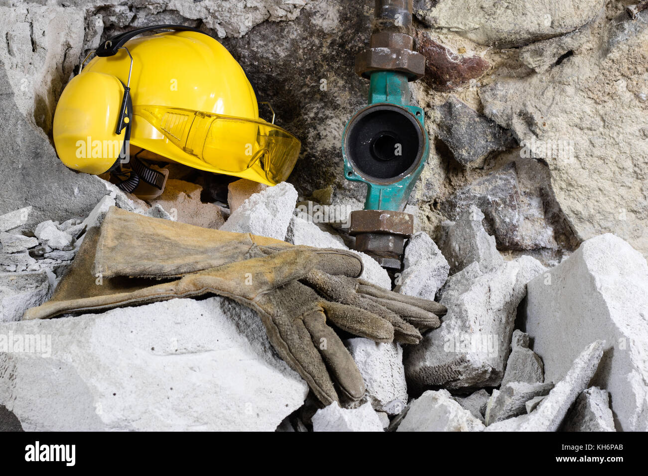 Demolition of walls. Electric hammer helmet and hearing protection ...