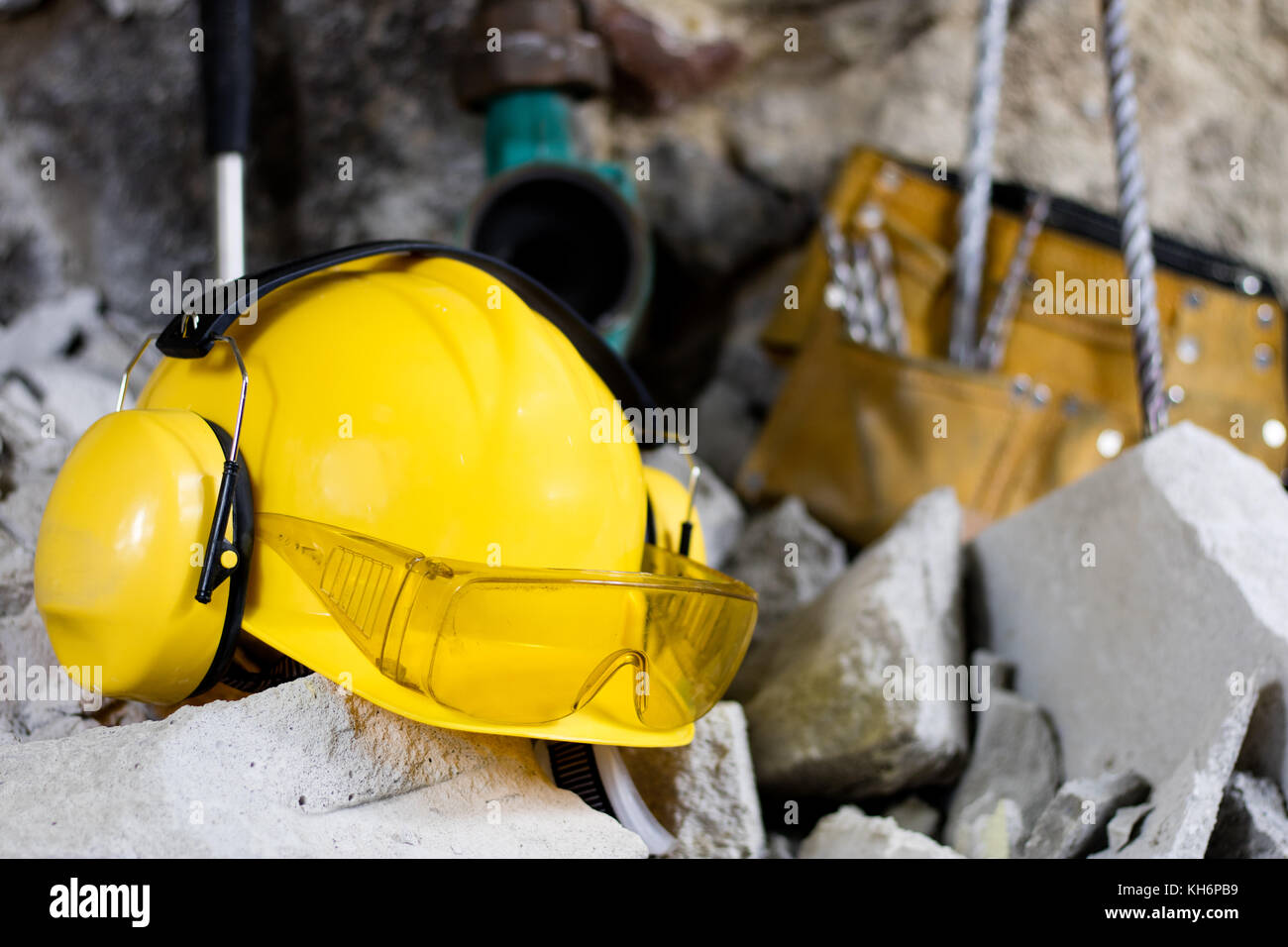 Demolition of walls. Electric hammer helmet and hearing protection ...