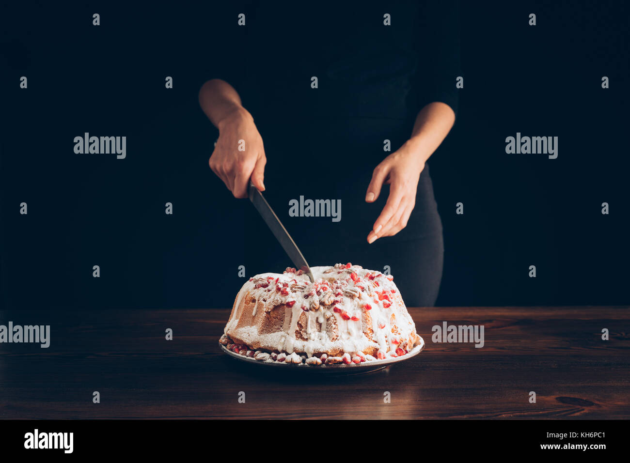 woman cutting traditional cake Stock Photo - Alamy