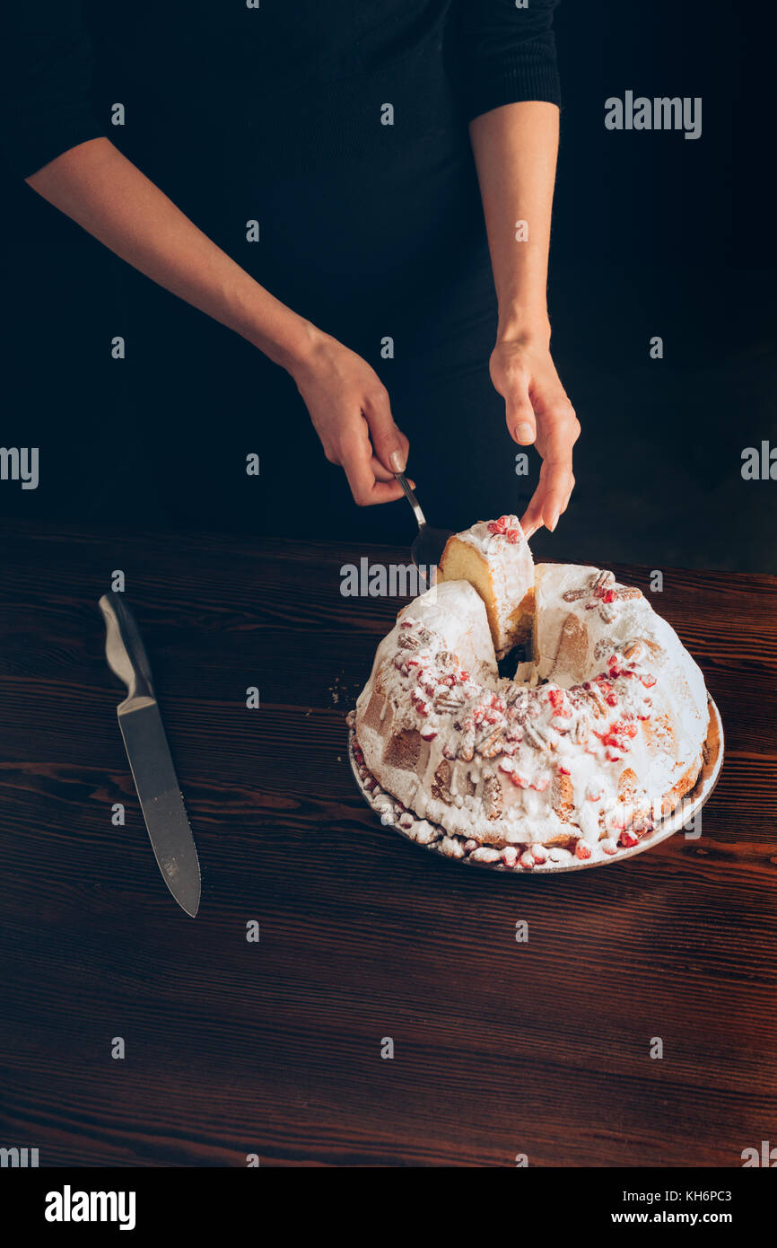 woman cutting christmas cake Stock Photo - Alamy