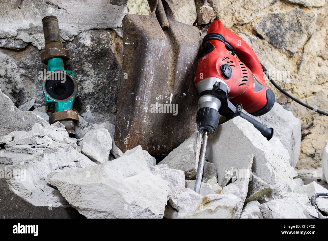 Demolition of walls. Electric hammer helmet and hearing protection ...