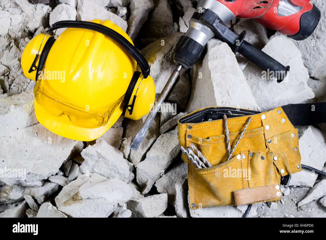 Demolition of walls. Electric hammer helmet and hearing protection ...
