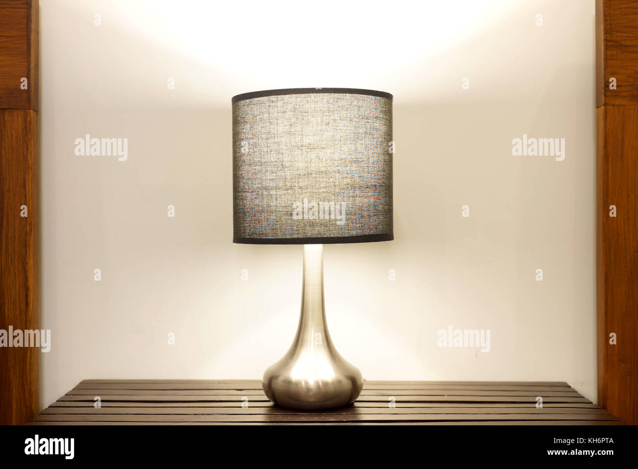 modern table lamp on white wall background Stock Photo - Alamy