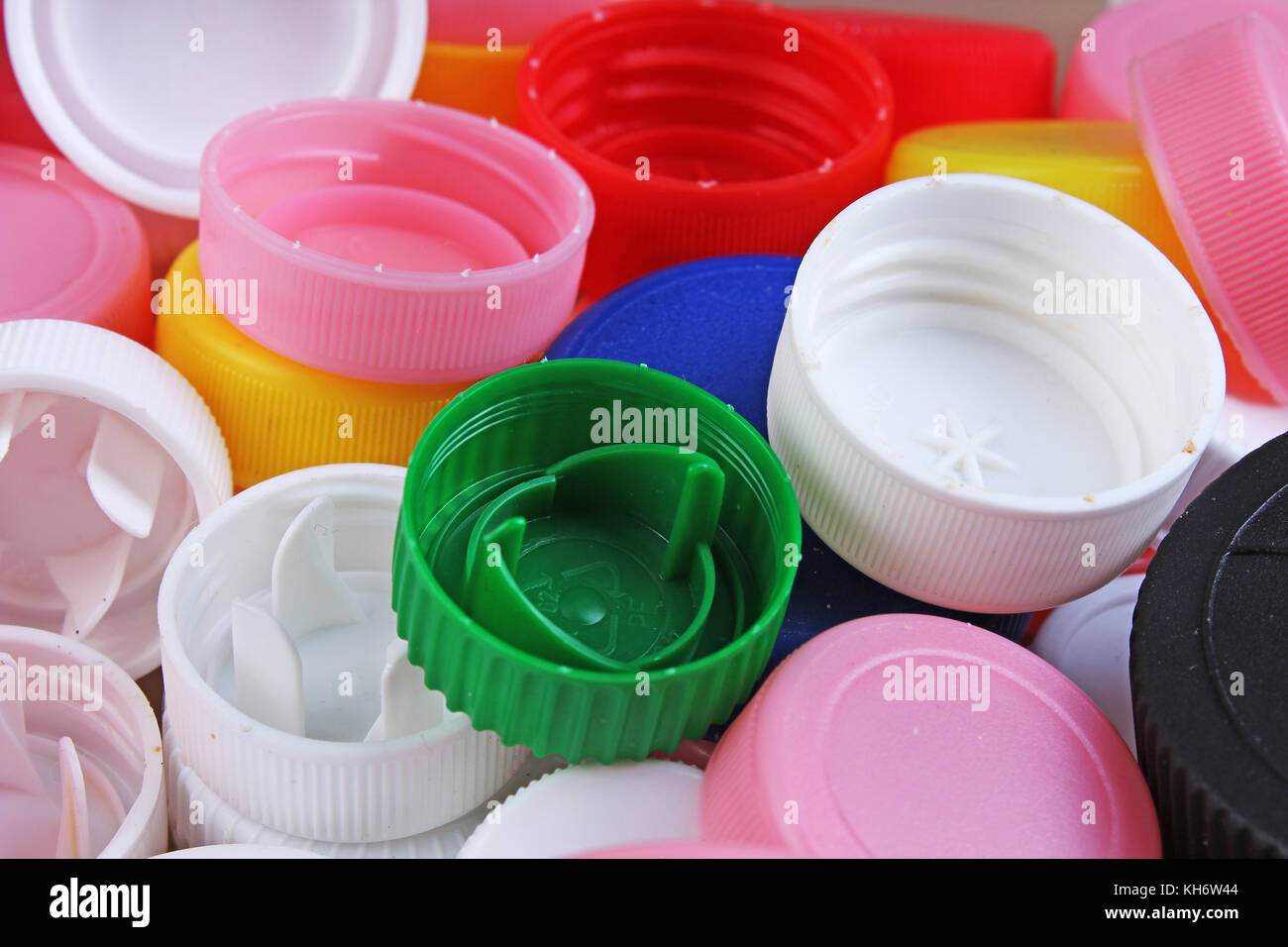 Plastic bottle caps. Close-up shot of stack of recyclable plastic ...