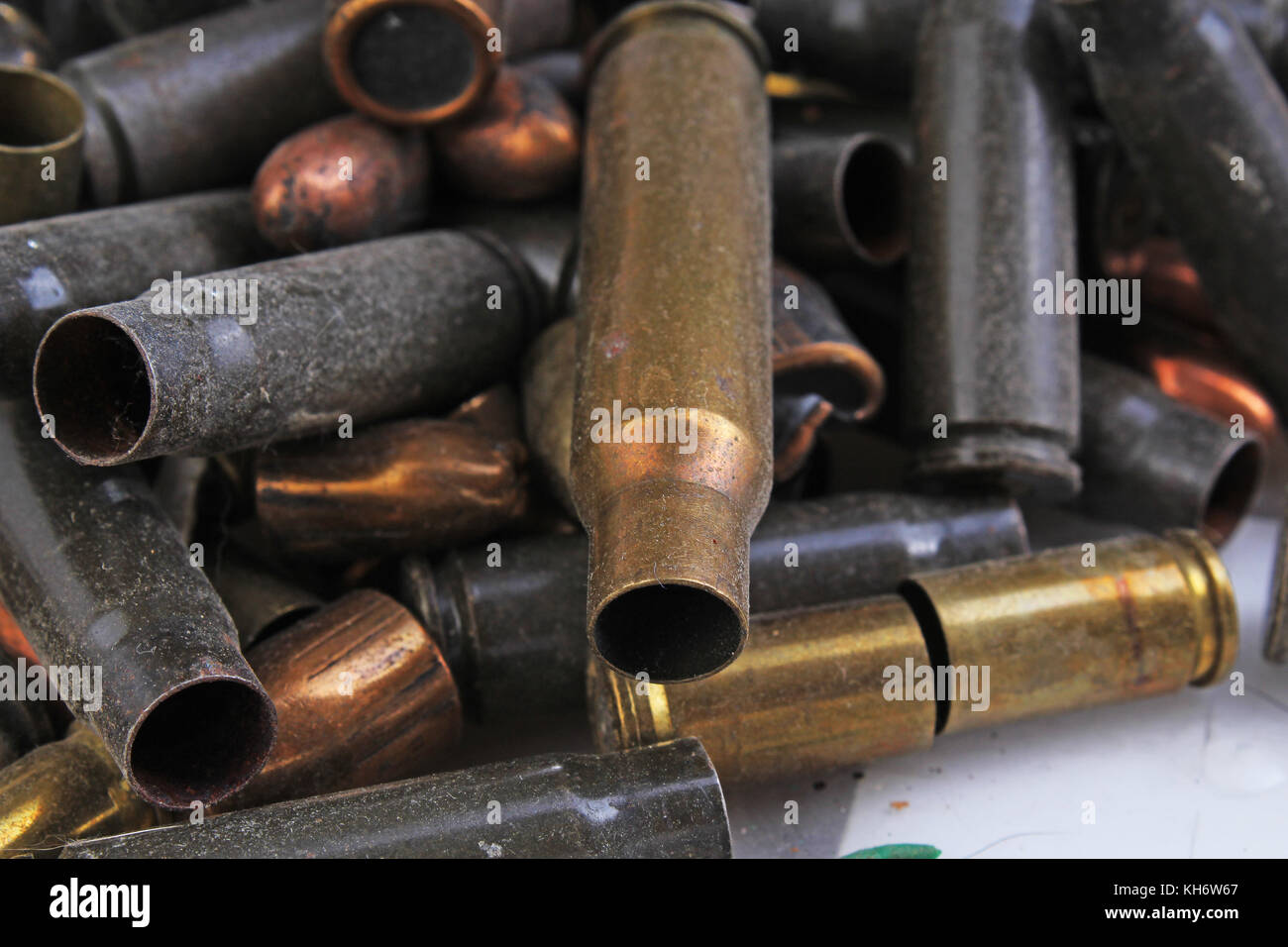 Heap of gun bullets. Weapon Cartridge case sleeve background texture, 7 ...