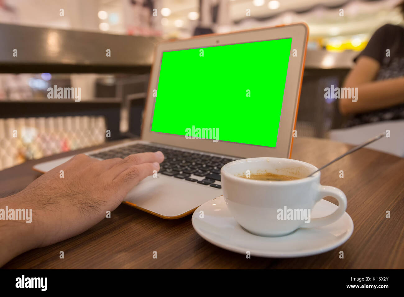 Youngman working with laptop in cafe, laptop with green screen Stock ...