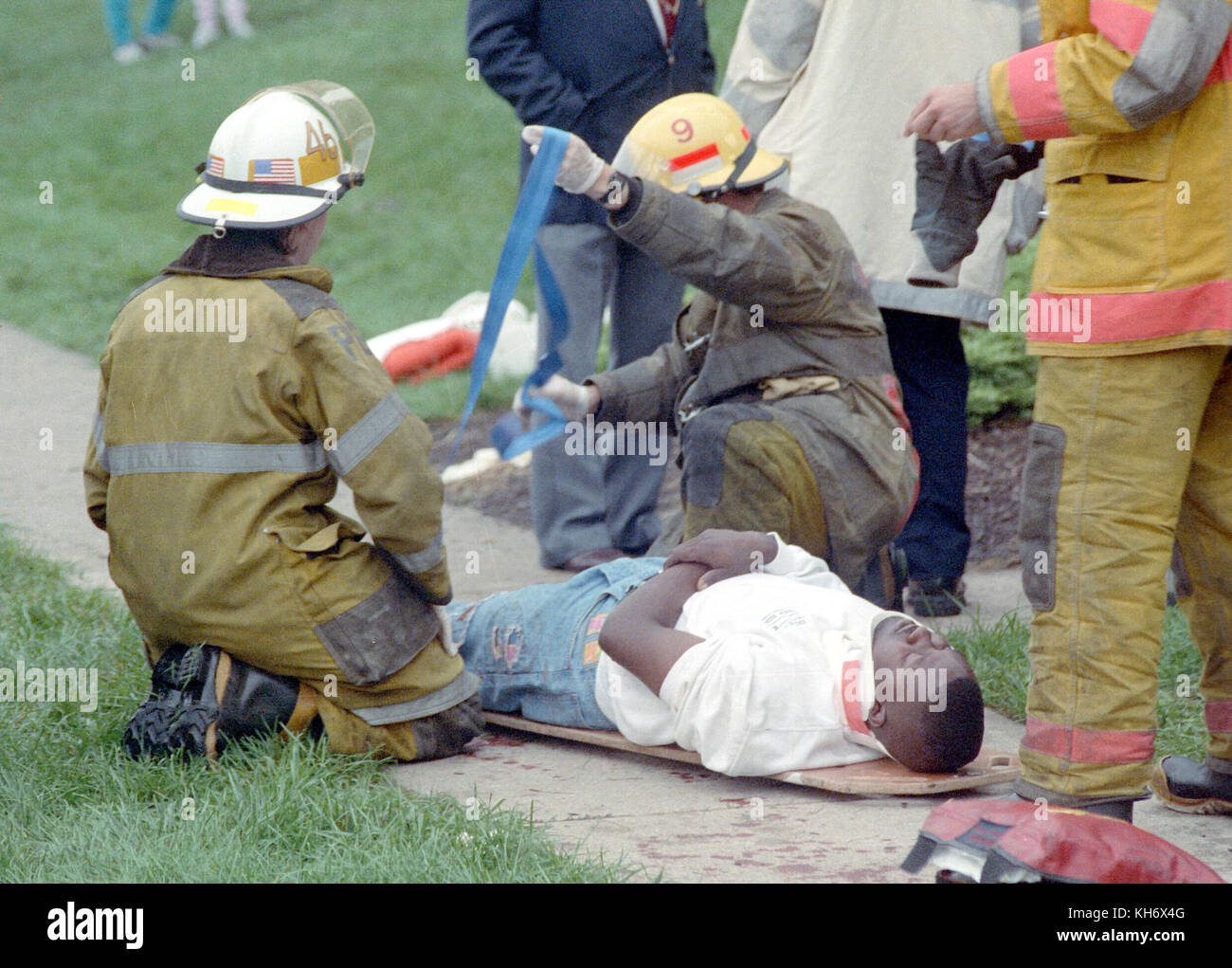 Rescue personnel work on an injured man Stock Photo - Alamy