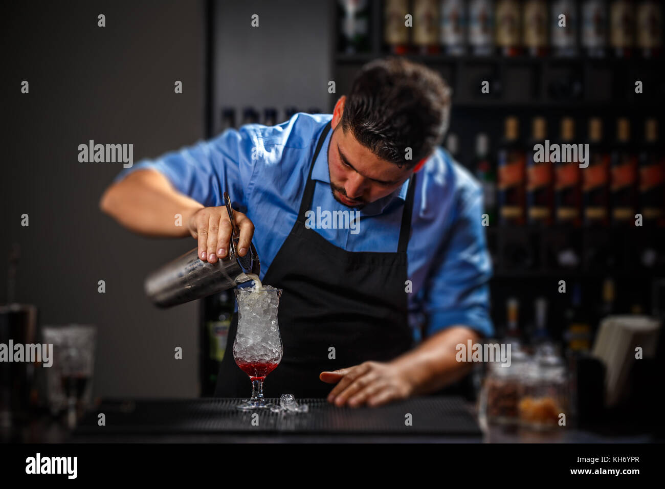 Liquid pouring cocktail glass in hi-res stock photography and images - Alamy