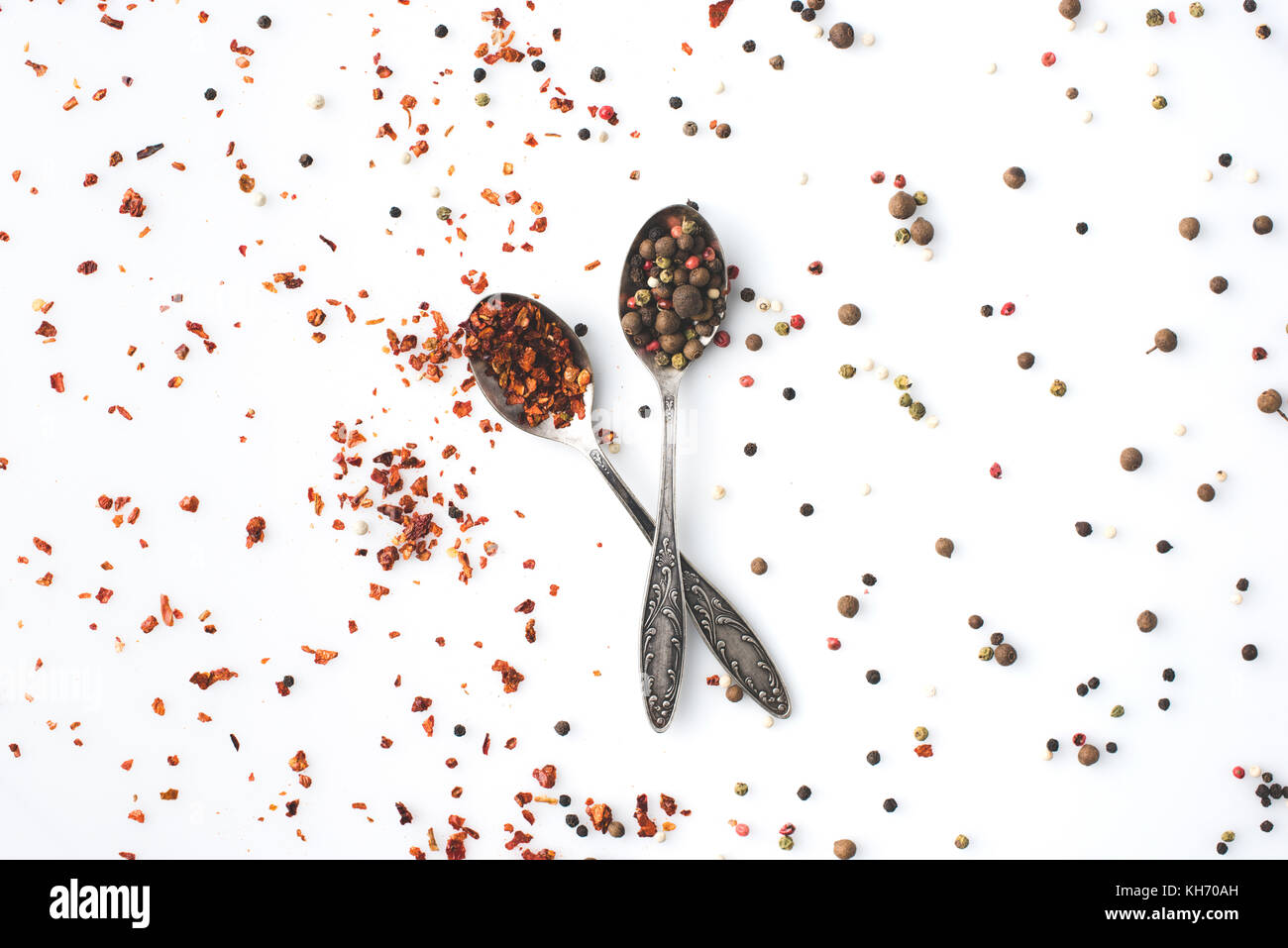 crossed spoons with pepper Stock Photo - Alamy