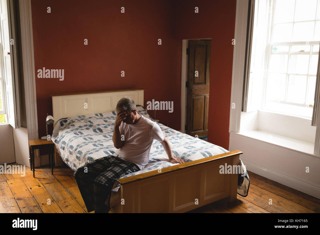 Worried senior man relaxing in bedroom at home Stock Photo - Alamy
