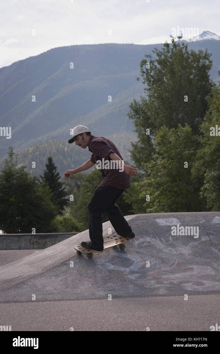 Man skating on skateboard in skate park Stock Photo - Alamy