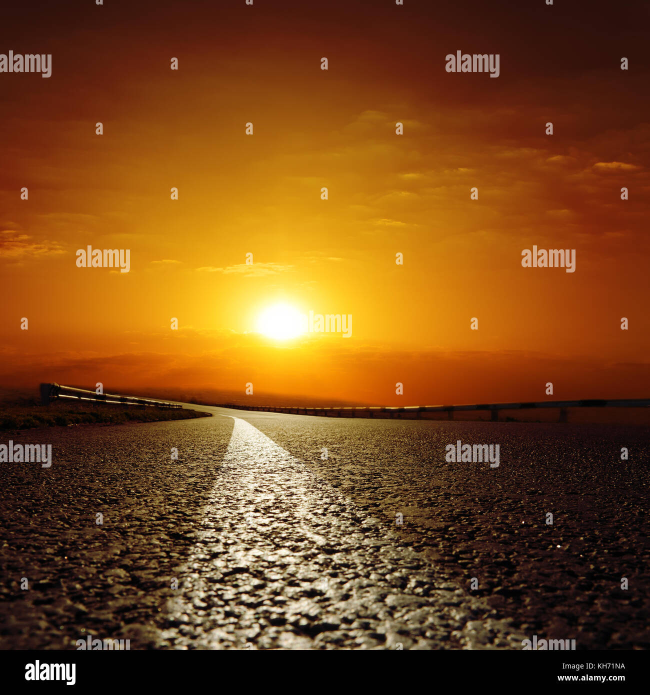 asphalt road to red sunset Stock Photo - Alamy