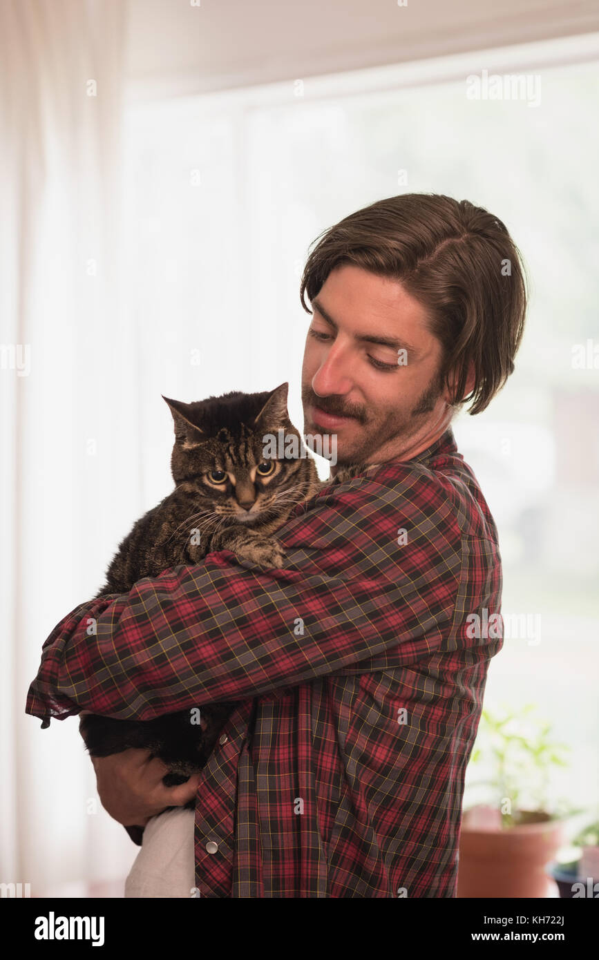 Man holding cat hi-res stock photography and images - Alamy