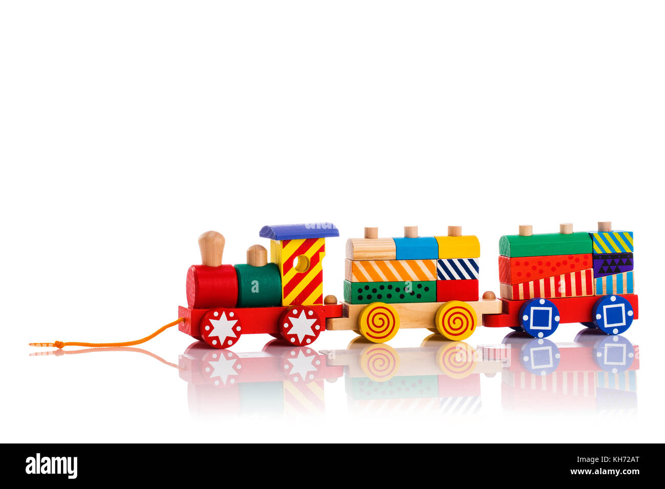 Wooden toy train with colorful blocks isolated over white background ...