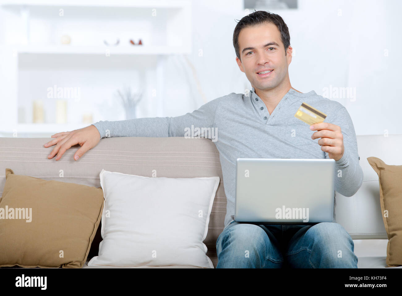 man holding his card Stock Photo - Alamy