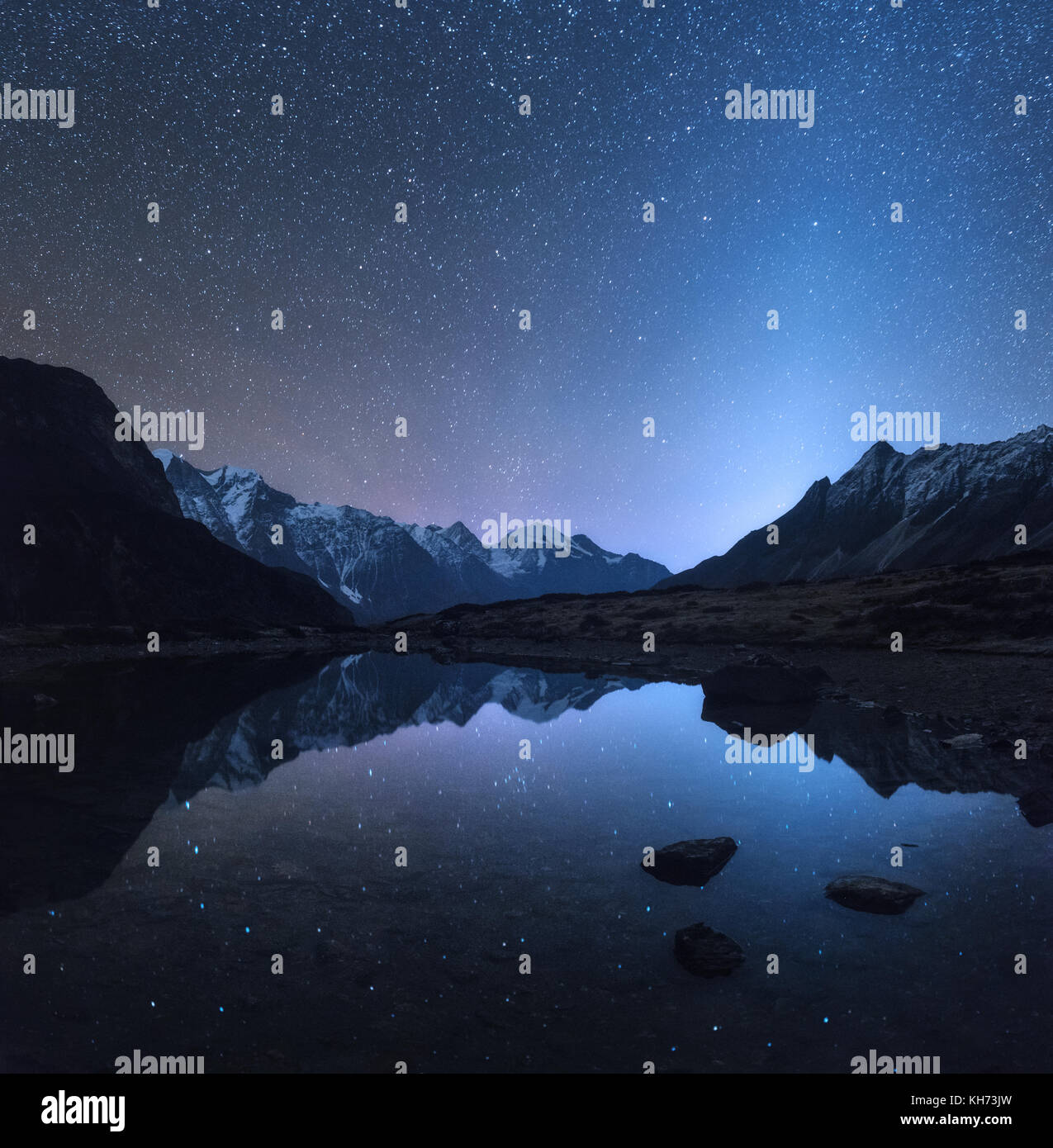 Starry night in Nepal. Amazing night scene with mountains and lake ...