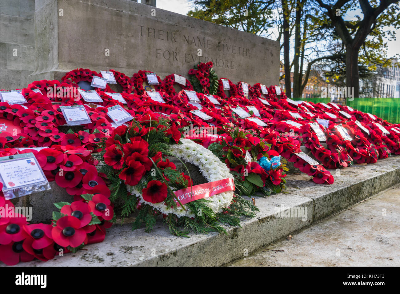 Red poppy wreaths laid during Remembrance Day commemoration at ...