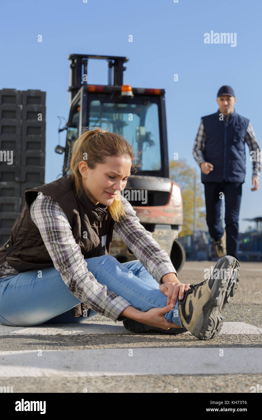 female worker with ankle injury Stock Photo - Alamy