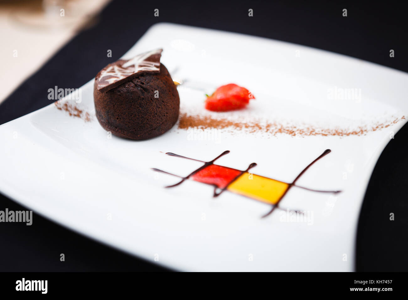 Chocolate fondant with vanilla ice cream and raspberry sauce Stock ...