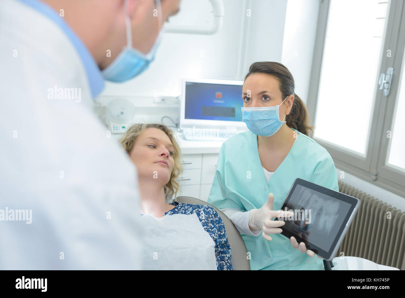 woman patient at dental surgery point teeth xray tablet dentist Stock ...