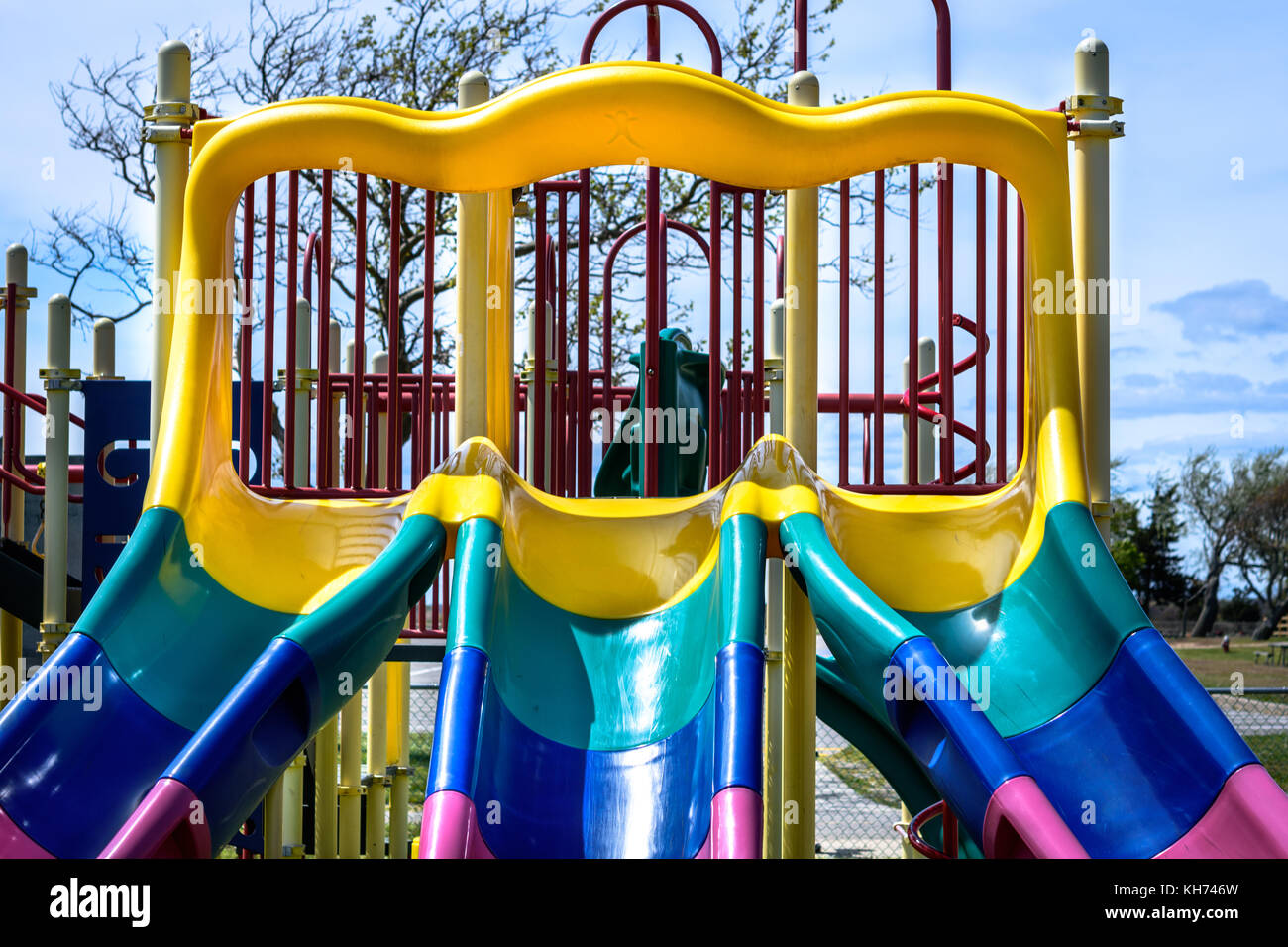 A set of 3 connecting colorful slides in a playground Stock Photo - Alamy