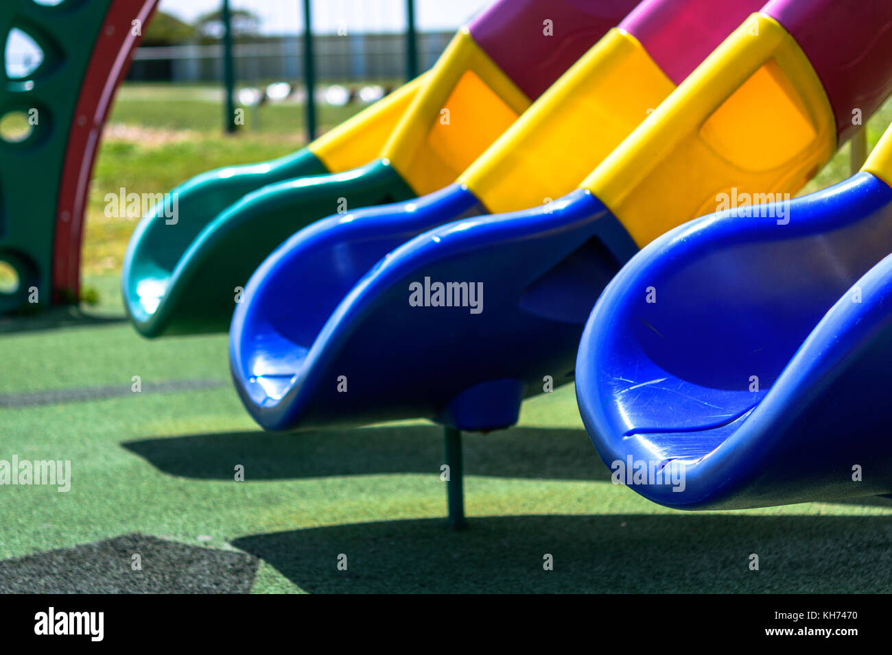 A set of 3 connecting colorful slides in a playground Stock Photo - Alamy