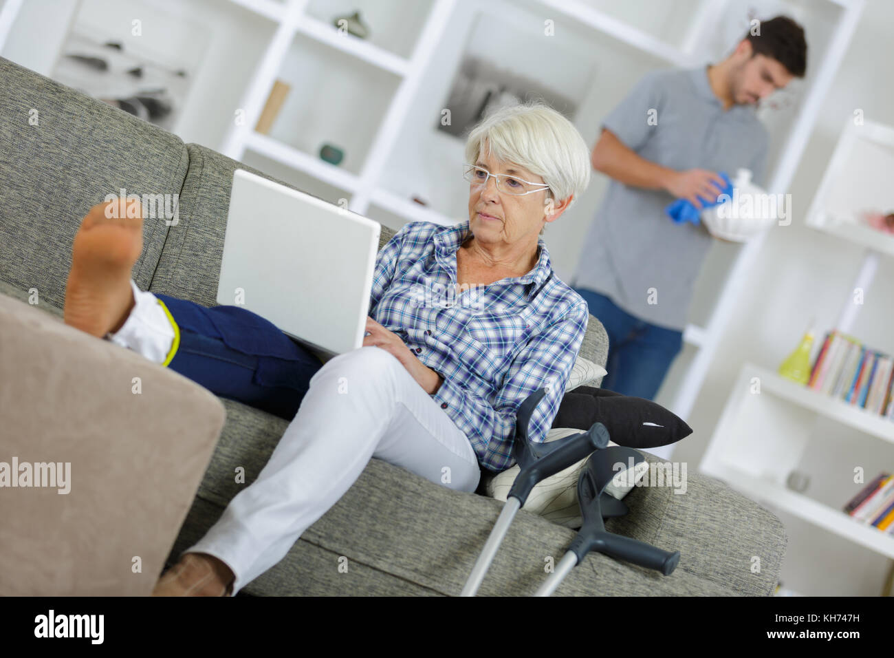 senior injured woman with laptop Stock Photo - Alamy