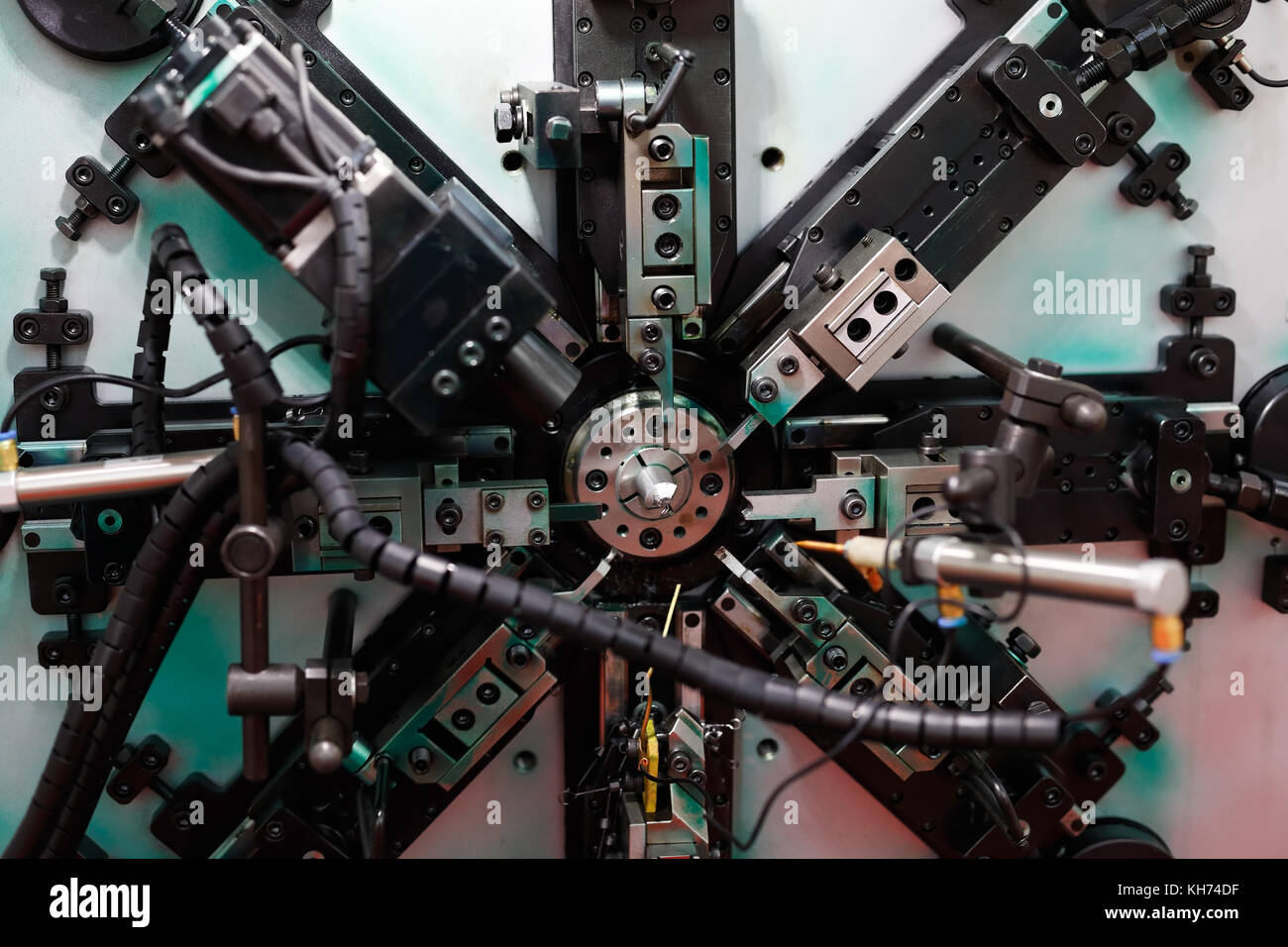 Industrial automatic spring coiling machine. Selective focus Stock ...