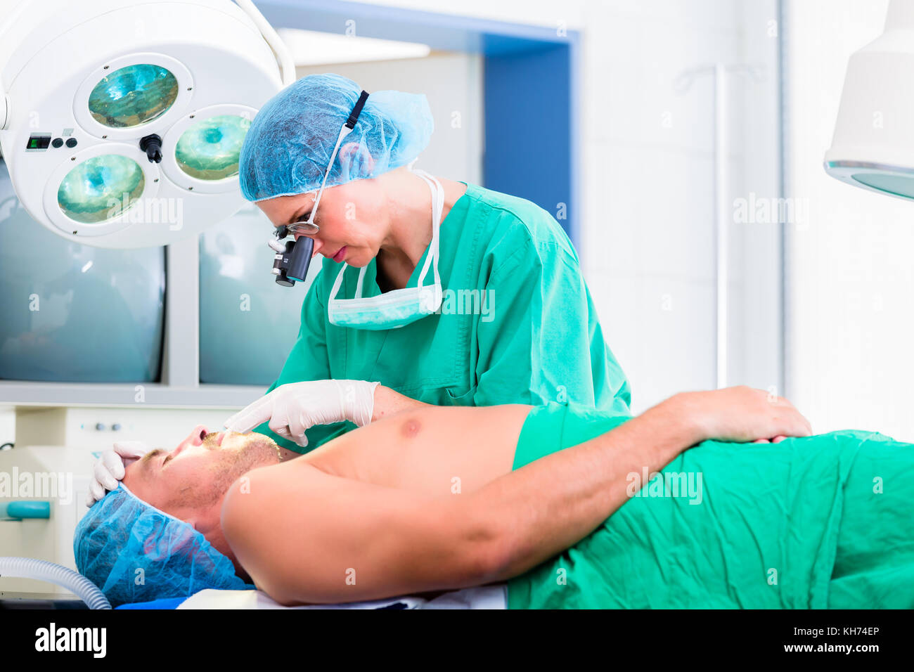 Orthopedic surgeon doctor operating patient in surgery or hospital ...