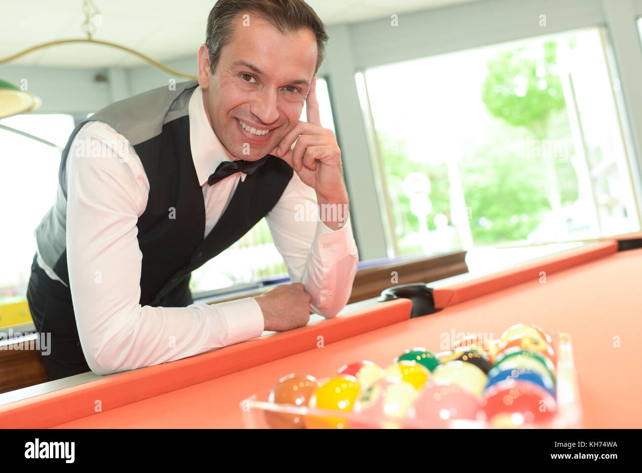 man posing on the billiard table Stock Photo - Alamy