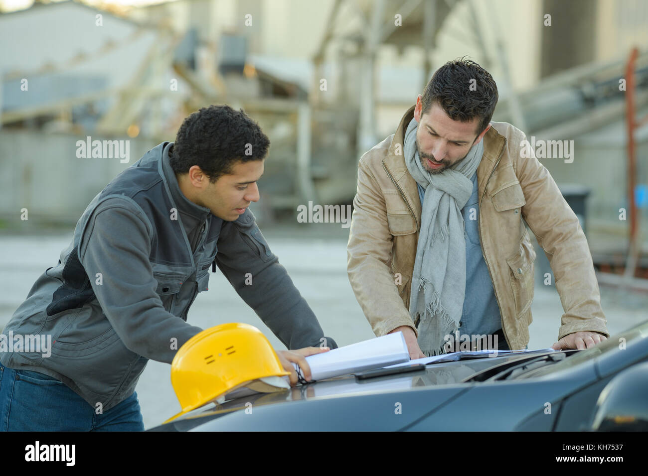 two workers before installing construction Stock Photo - Alamy