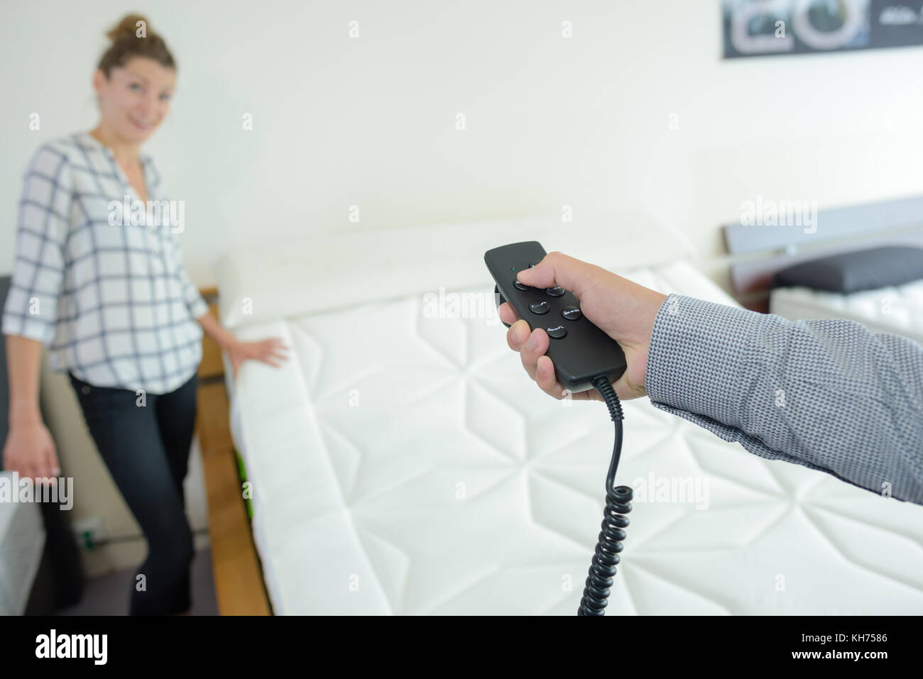 male holding electrical remote control for an electric bed Stock Photo ...