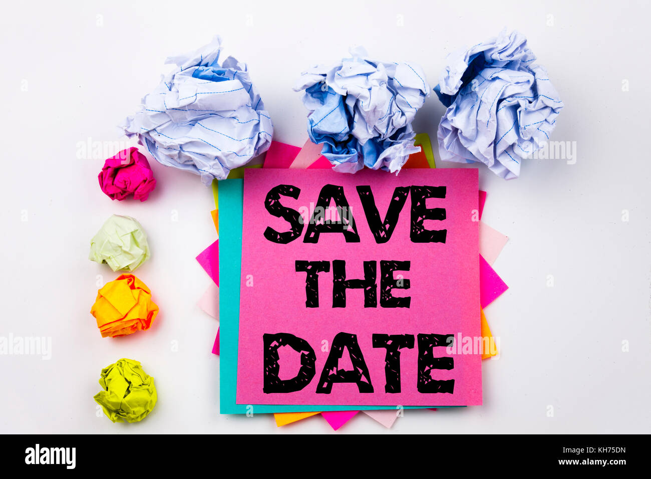 Writing text showing Save The Date written on sticky note in office ...