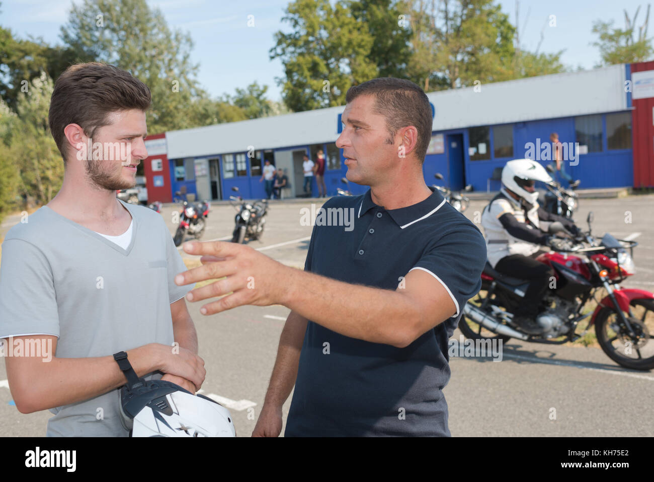 professional trainer during lesson with young man Stock Photo - Alamy