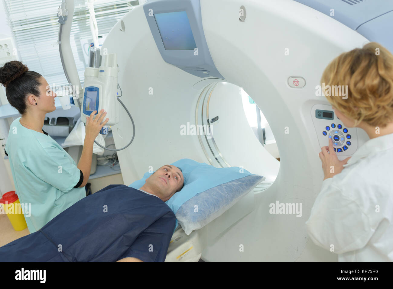 male patient undergoing test at ct scanner machine Stock Photo - Alamy