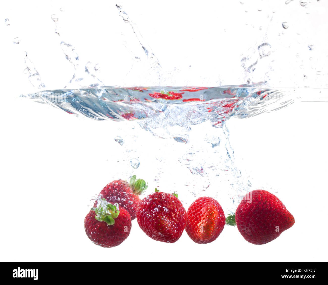Ripe Strawberries Dropping Into Water Stock Photo - Alamy