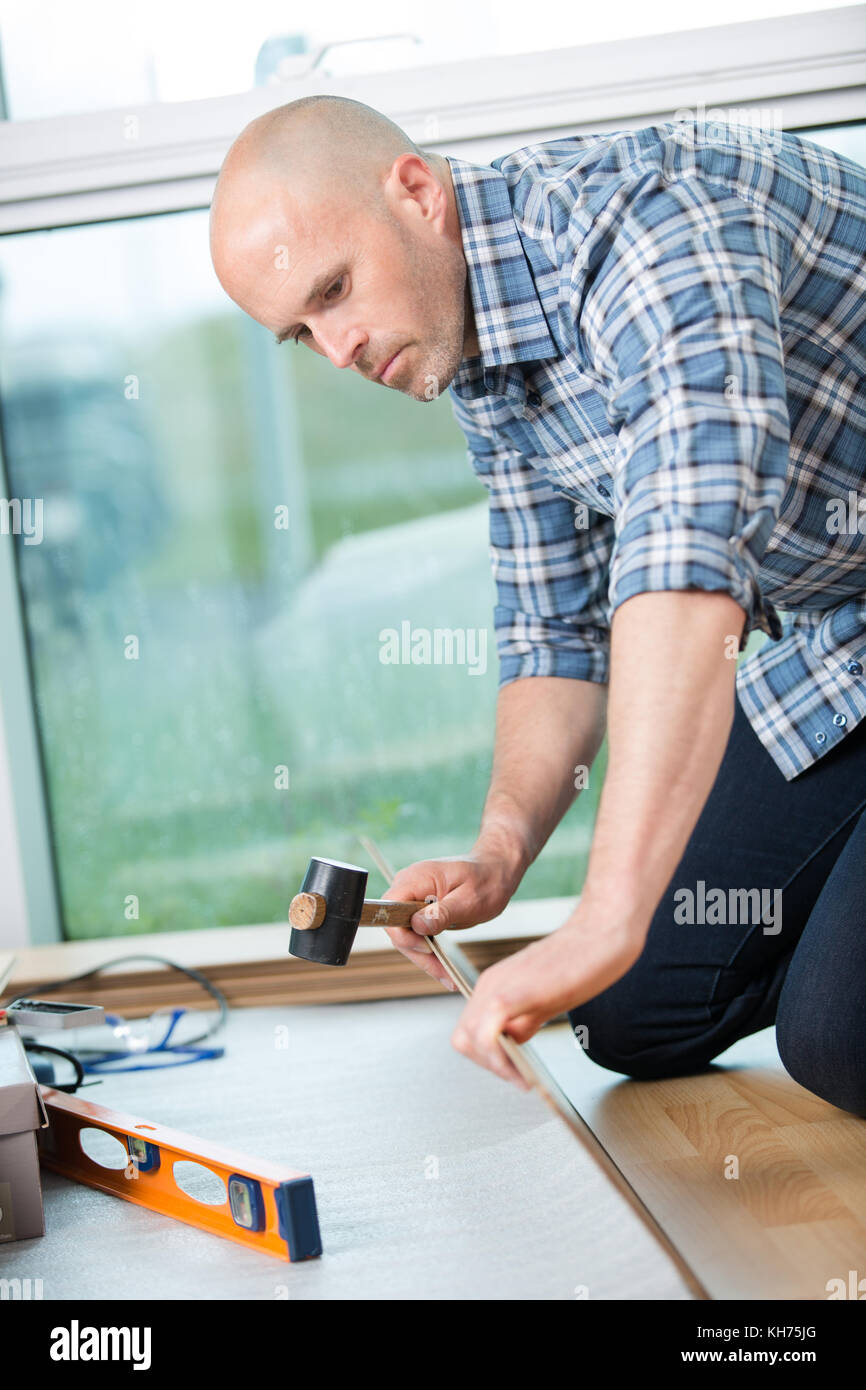 man working on wood floor Stock Photo - Alamy