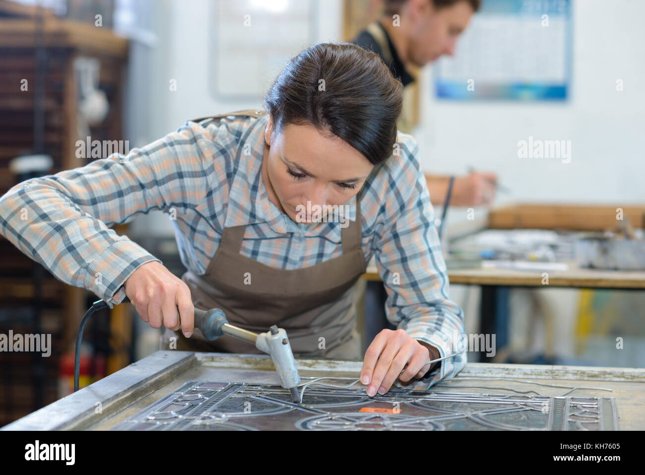 Woman working with stained glass Stock Photo - Alamy