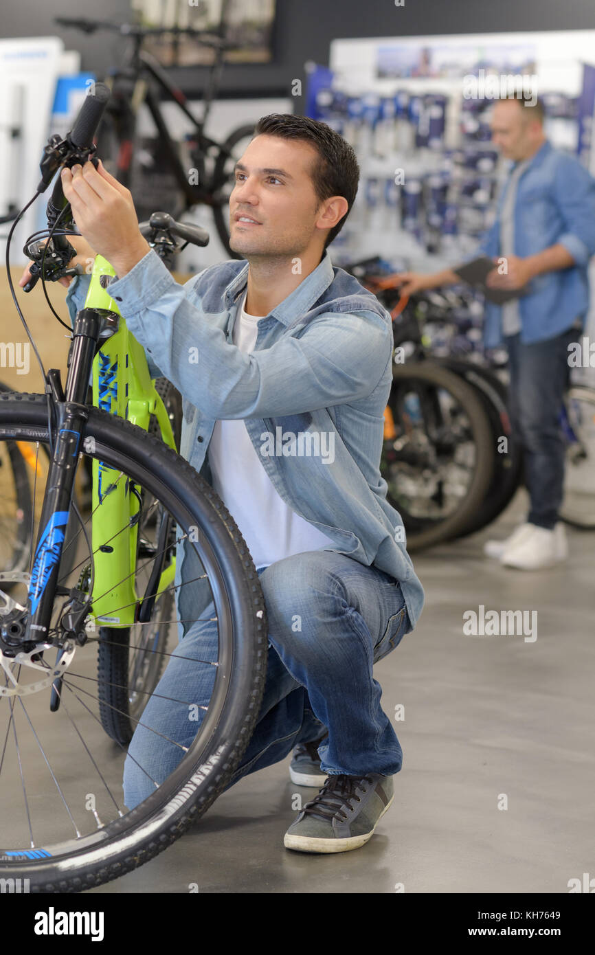 portrait of young male mechanic in bicycle store Stock Photo - Alamy