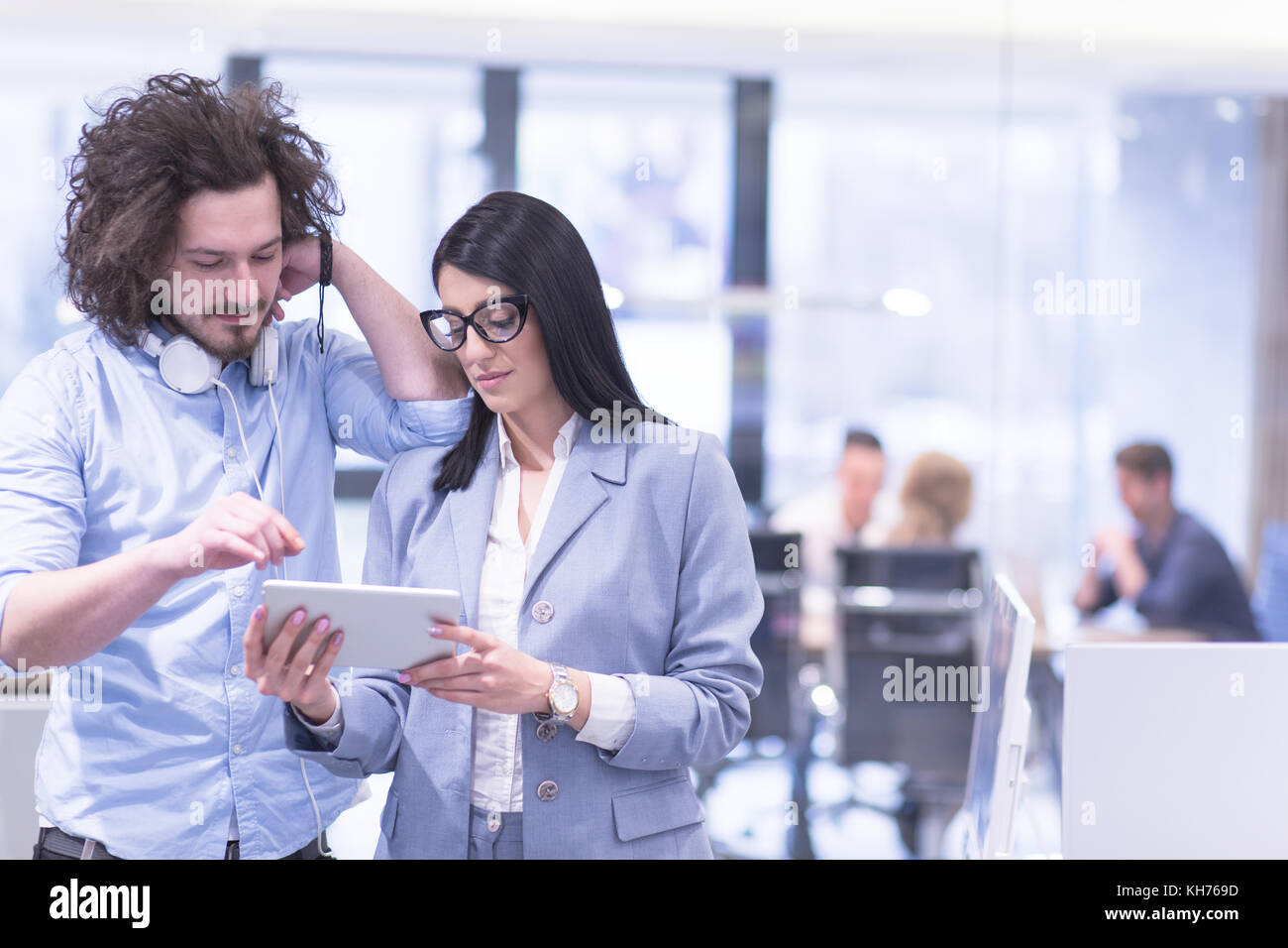 business people using tablet computer while preparing for next meeting ...
