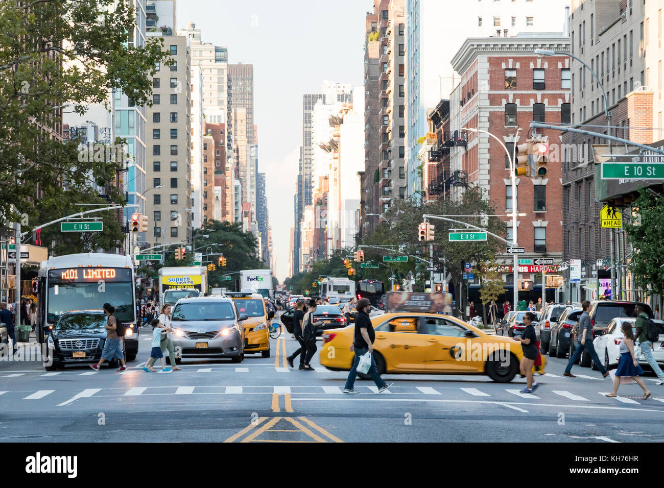 NEW YORK CITY - CIRCA 2017: Busy people walk across an intersection at ...