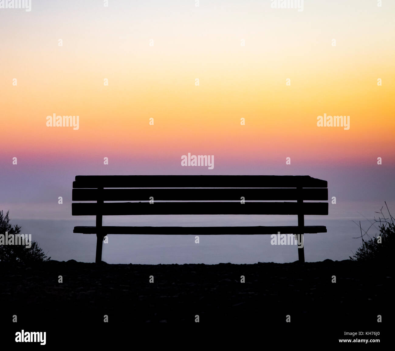 Empty bench overlooking calm sea bench hi-res stock photography and ...
