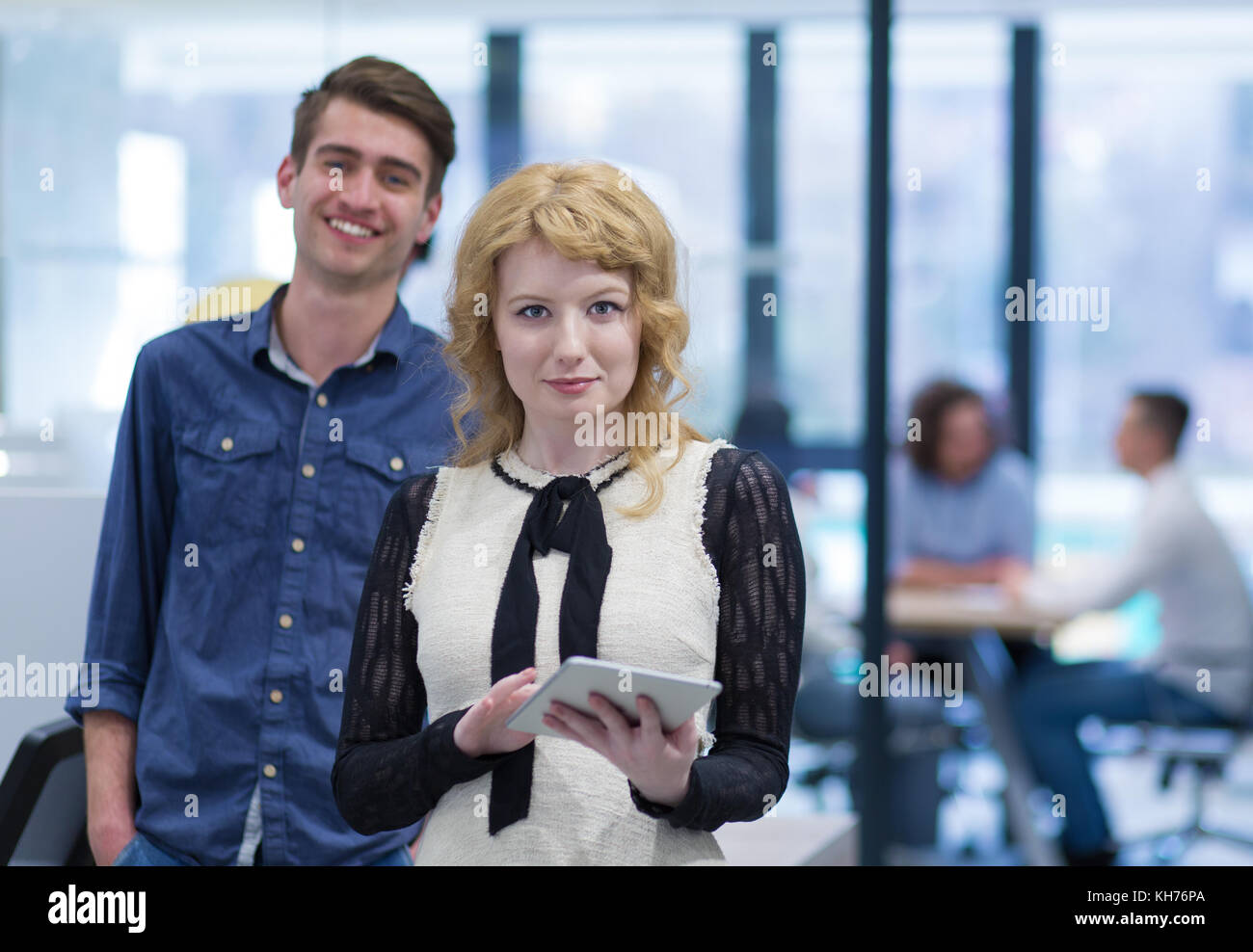 business people using tablet computer while preparing for next meeting ...