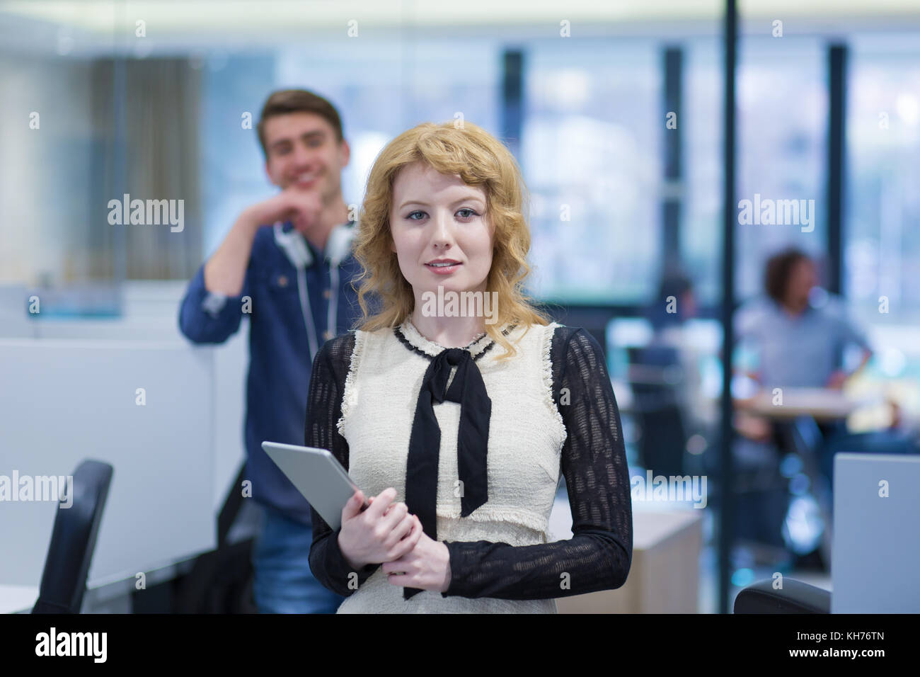 business people using tablet computer while preparing for next meeting ...
