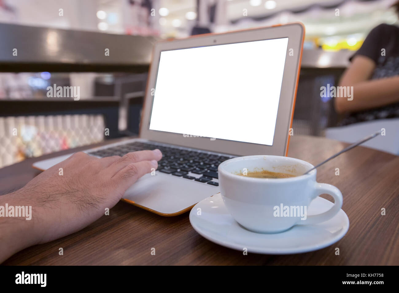 Close up of business man hand working on blank screen laptop computer ...