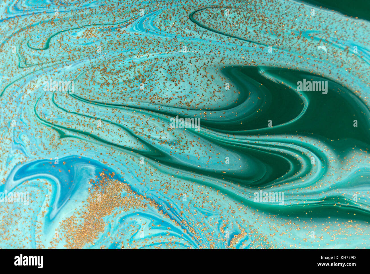 Marbled green and blue abstract background with golden sequins. Liquid ...