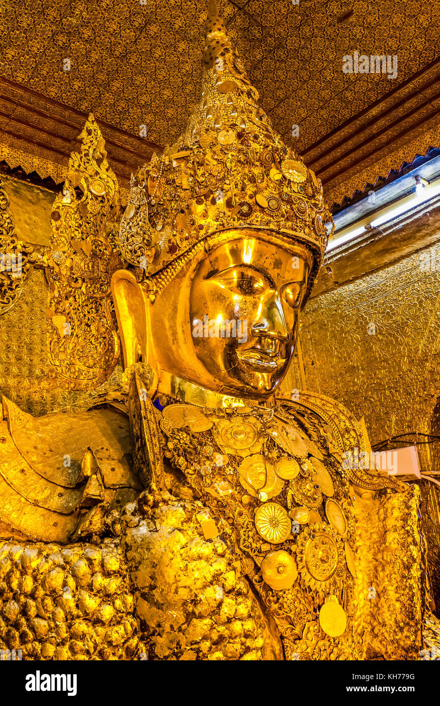 Golden Buddha statue in the Mahamuni Buddha Temple, Mandalay, Myanmar ...