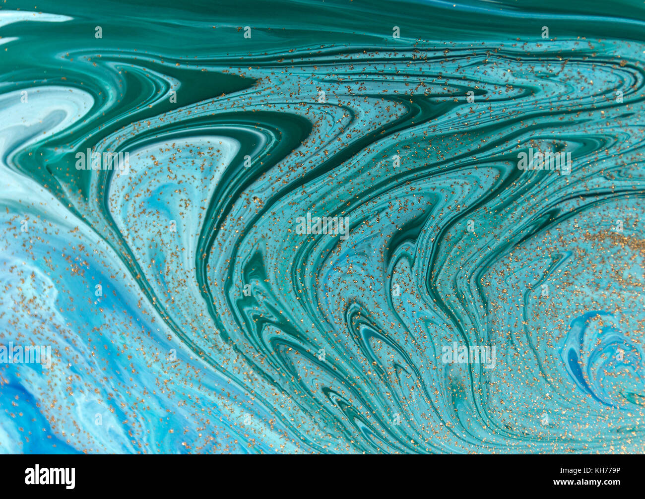 Marbled green and blue abstract background with golden sequins. Liquid ...